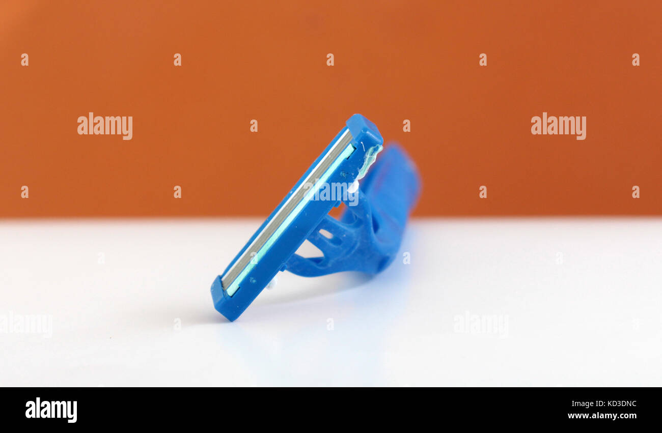 used shaving razor on a white brown background,image Stock Photo - Alamy