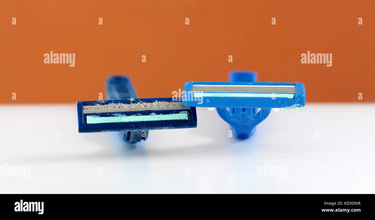 used shaving razor on a white brown background,image Stock Photo - Alamy