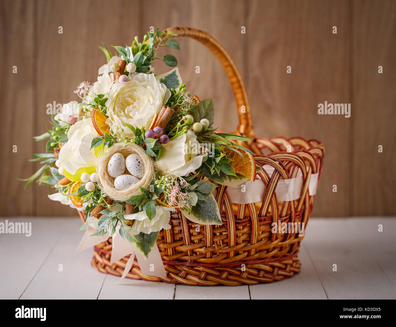 Wicker Designer Basket decorated with flower Stock Photo - Alamy