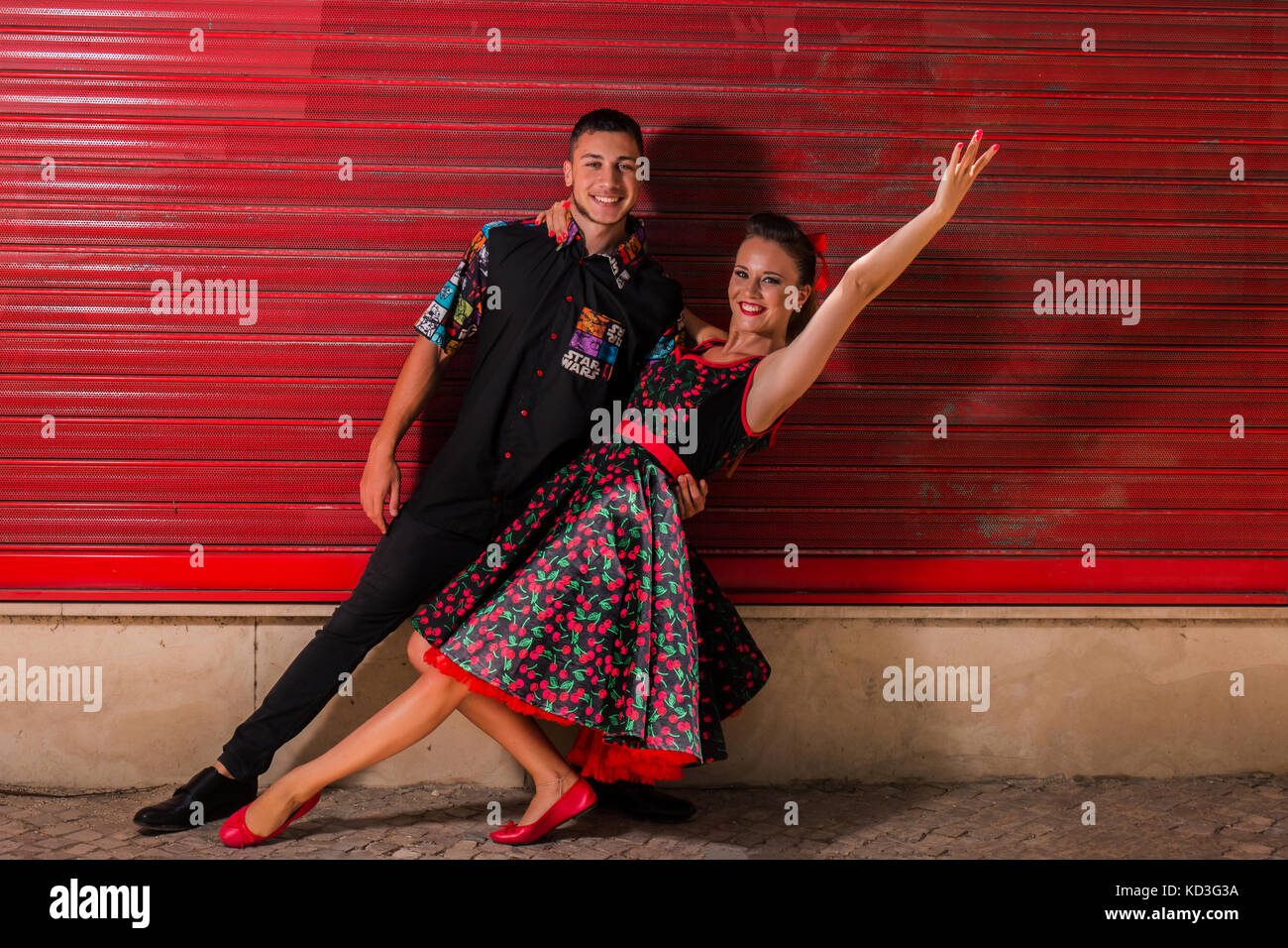 Vintage couple dancing over a red background Stock Photo - Alamy
