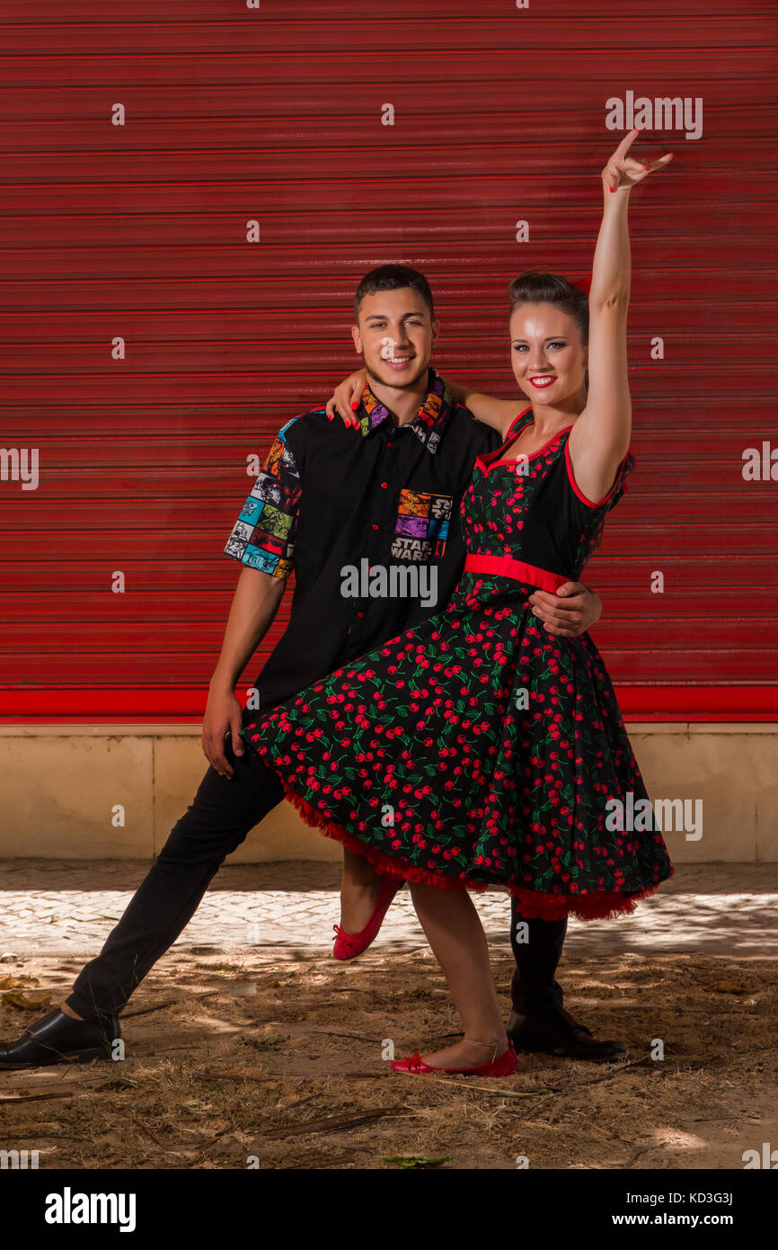 Vintage couple dancing over a red background Stock Photo - Alamy