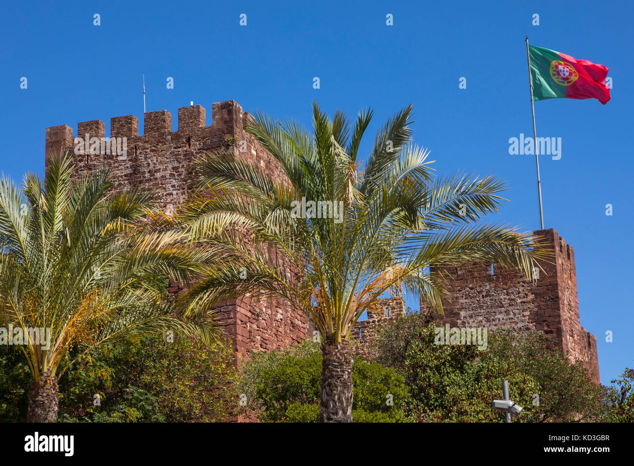 Looking up at one of the imposing towers of Silves Castle in the ...