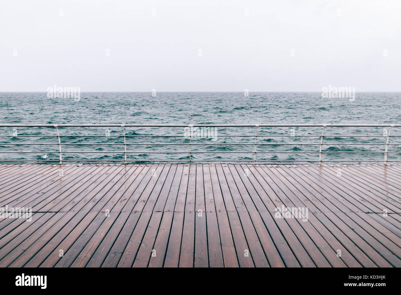 View of the sea embankment in the rain Stock Photo - Alamy