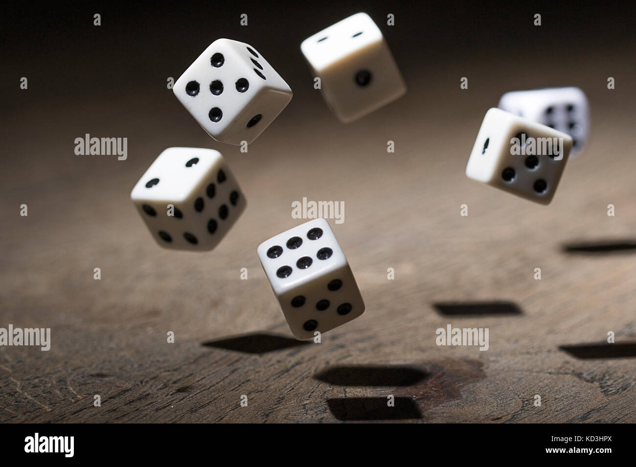 Play a game - Dice in mid air Stock Photo - Alamy