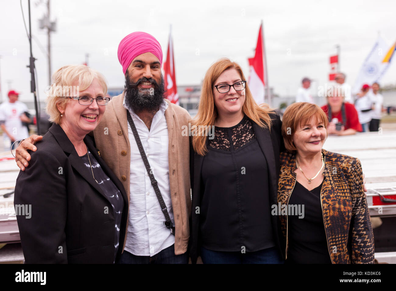 Jagmeet Singh, leader of the New Democratic Party of Canada is flanked ...