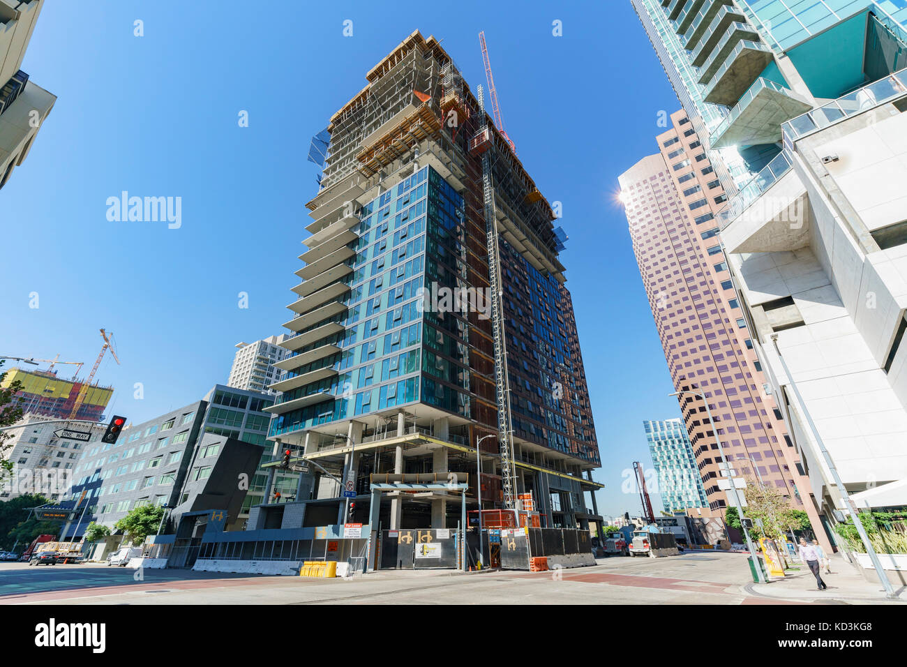Tall building under construction at downtown Stock Photo - Alamy