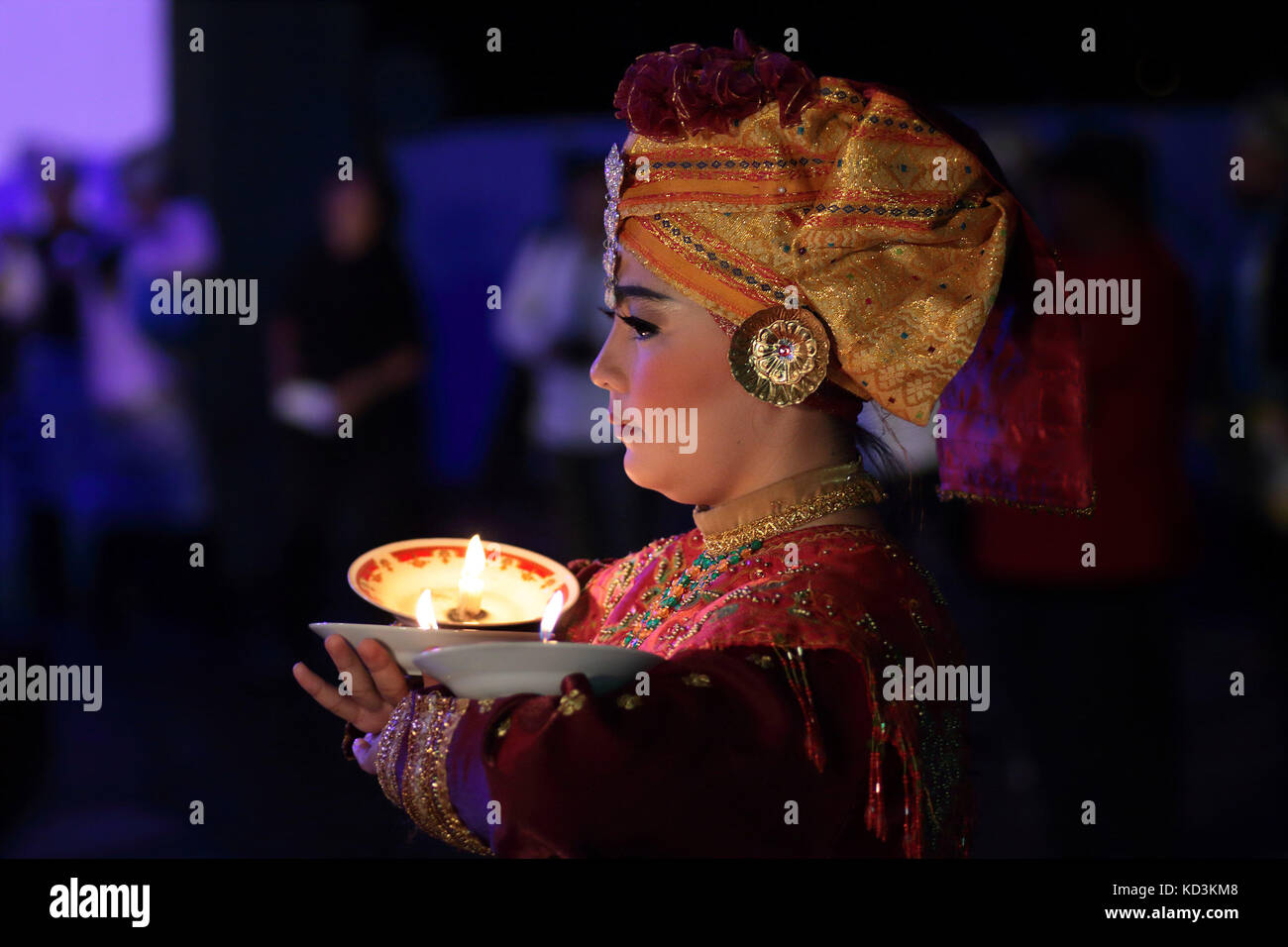 Indonesian traditional dancer lighted up by candle light Stock Photo ...
