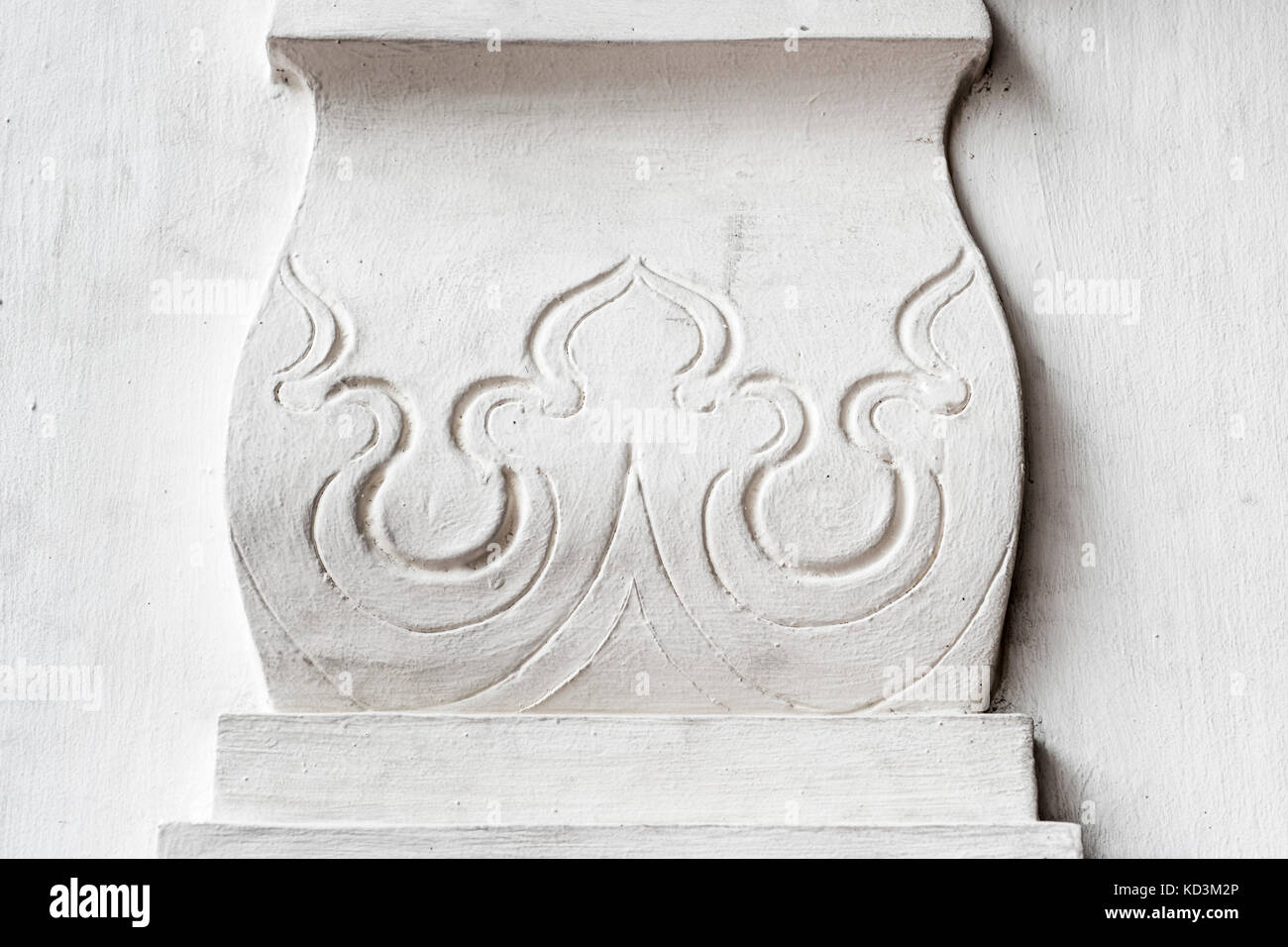 soft white column decoration relief on the wall of traditional Hindu ...