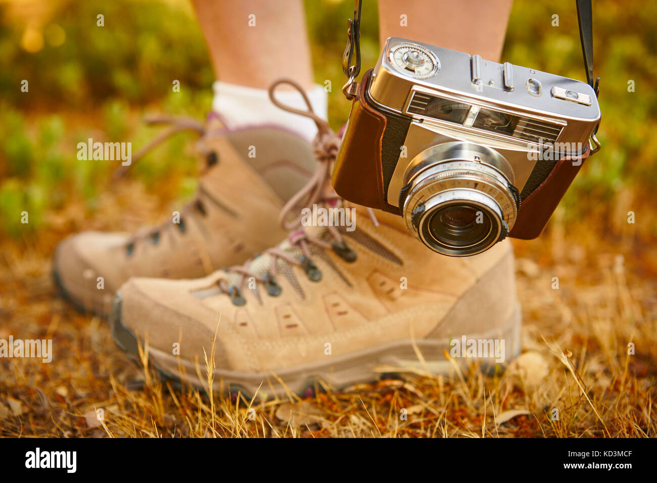 Vintage camera with hiking boots on the ground. Travel background Stock ...