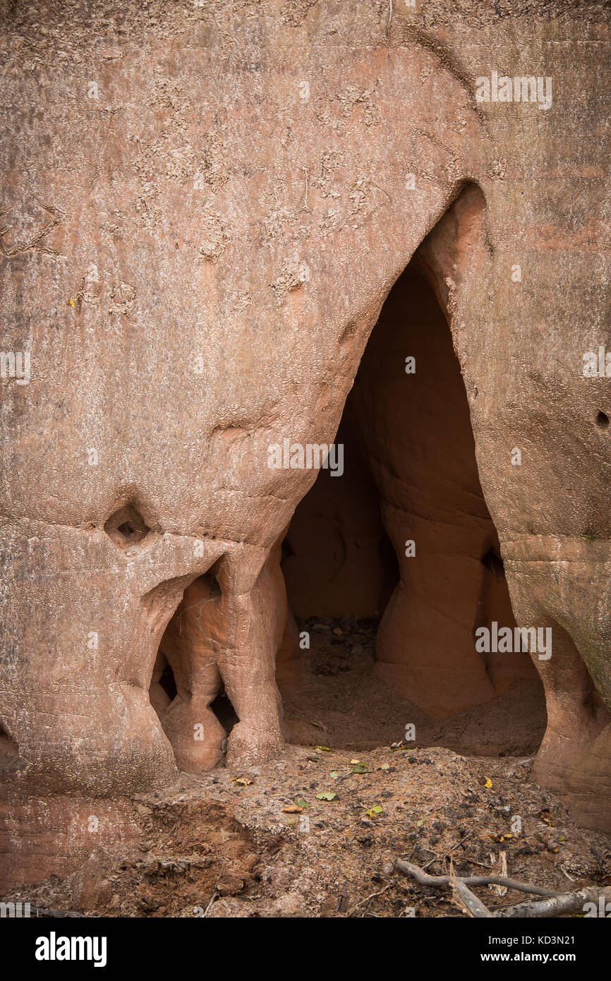 A beautiful seaside landscape with a sandstone caves. Orange sandstone ...