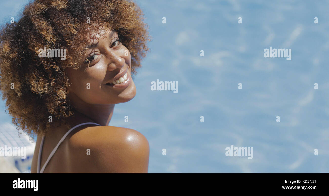 Beautiful model posing in pool Stock Photo - Alamy