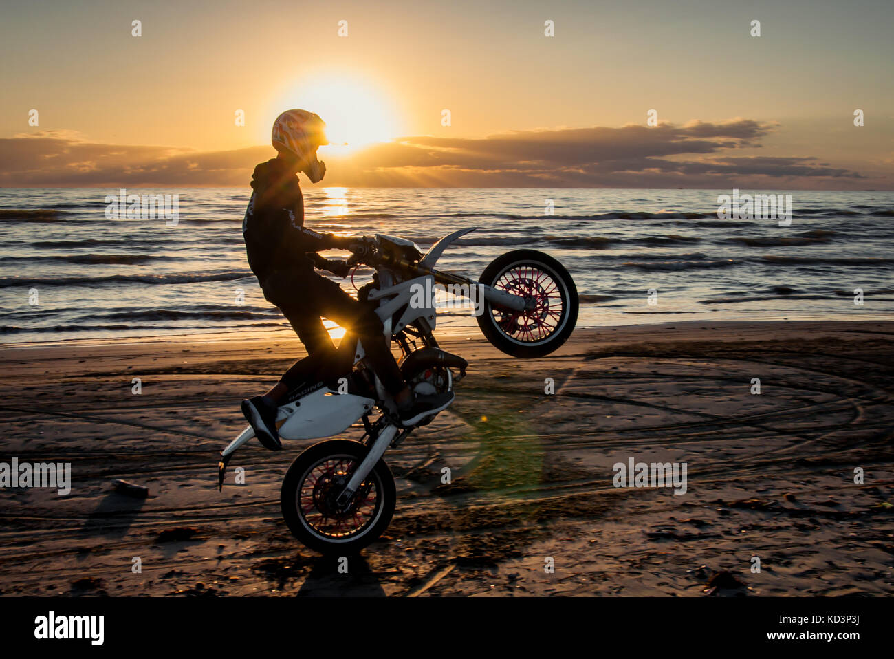 Motocross at sunset Stock Photo - Alamy