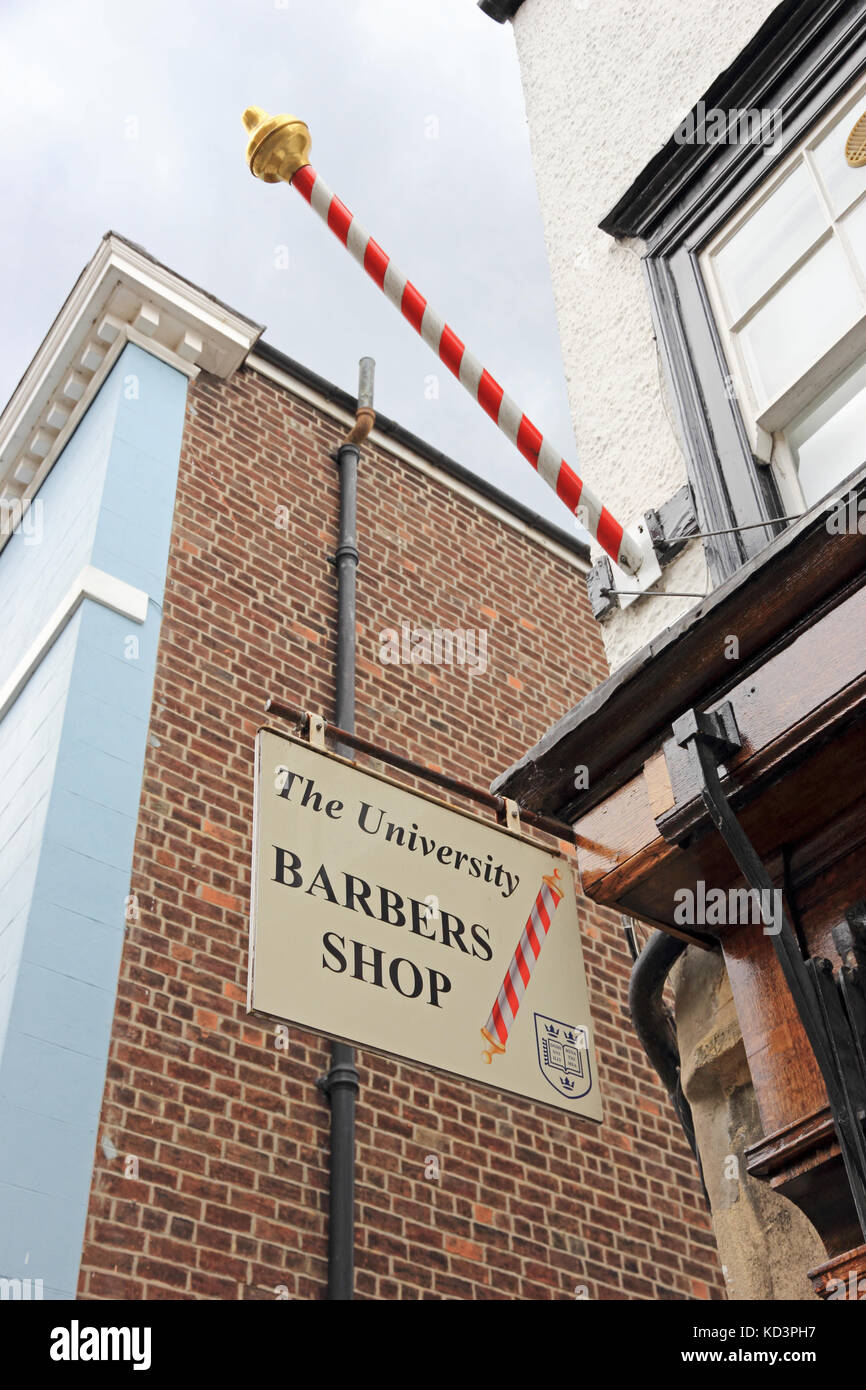 The University Barbers Shop sign, with traditional red and white ...