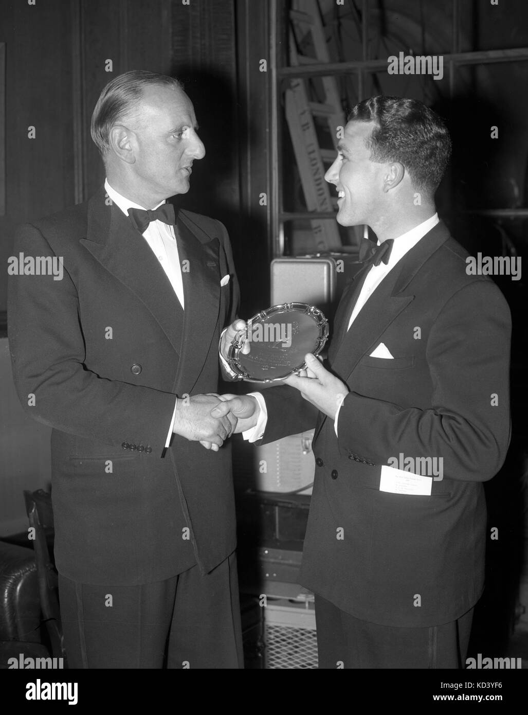 Brian Taylor (r), 24-year-old Essex batsman and wicketkeeper, receives ...