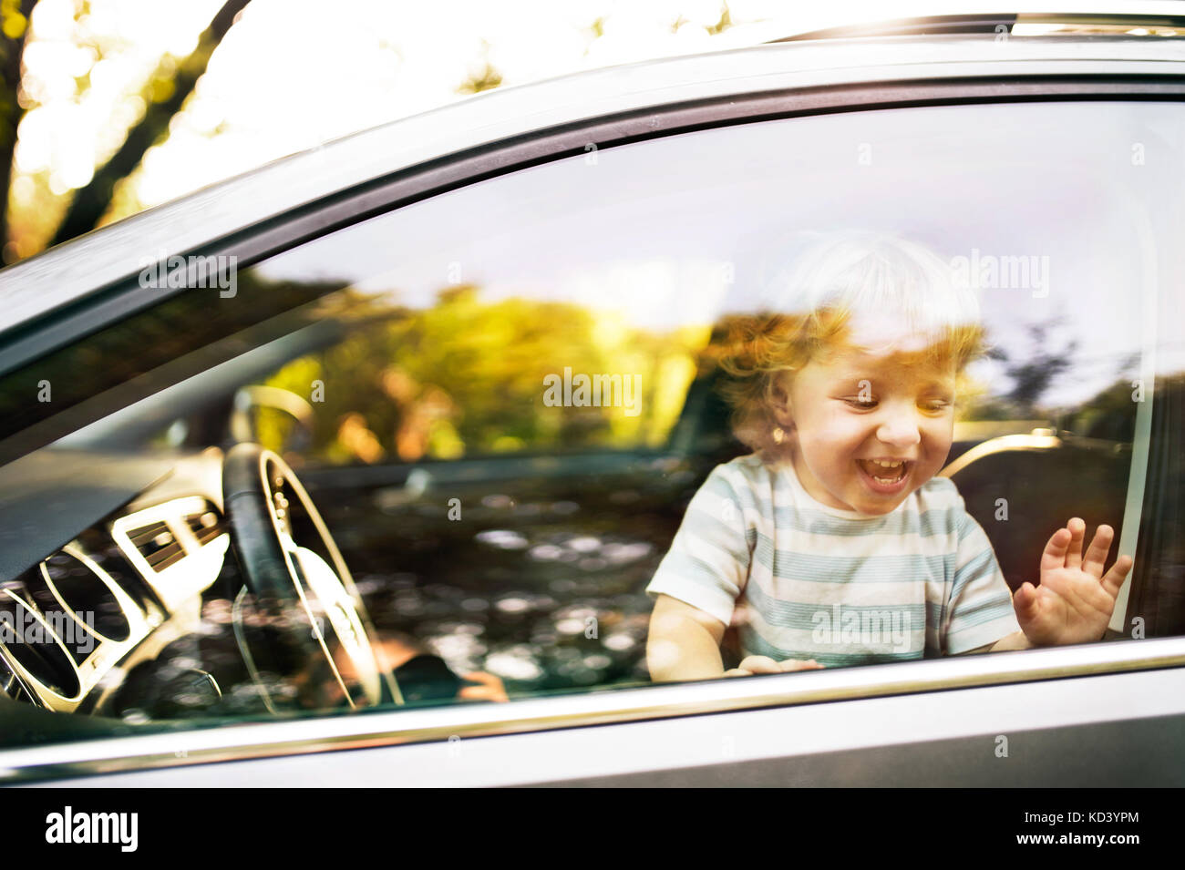 Playing boy smiling window kid cute hi-res stock photography and images ...