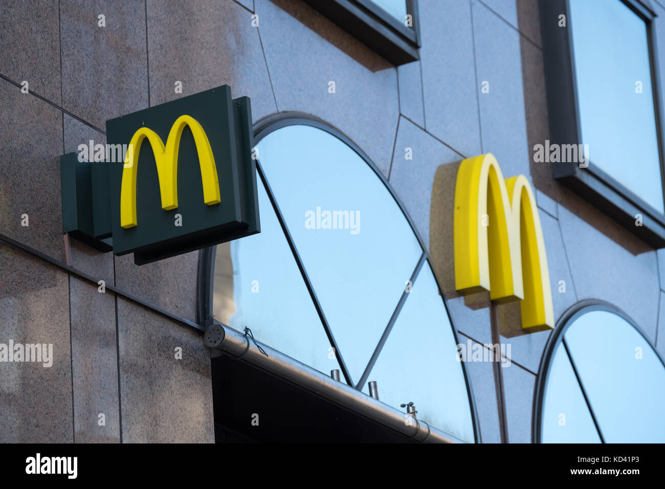 Fast food restaurant McDonalds logo on the wall Stock Photo - Alamy
