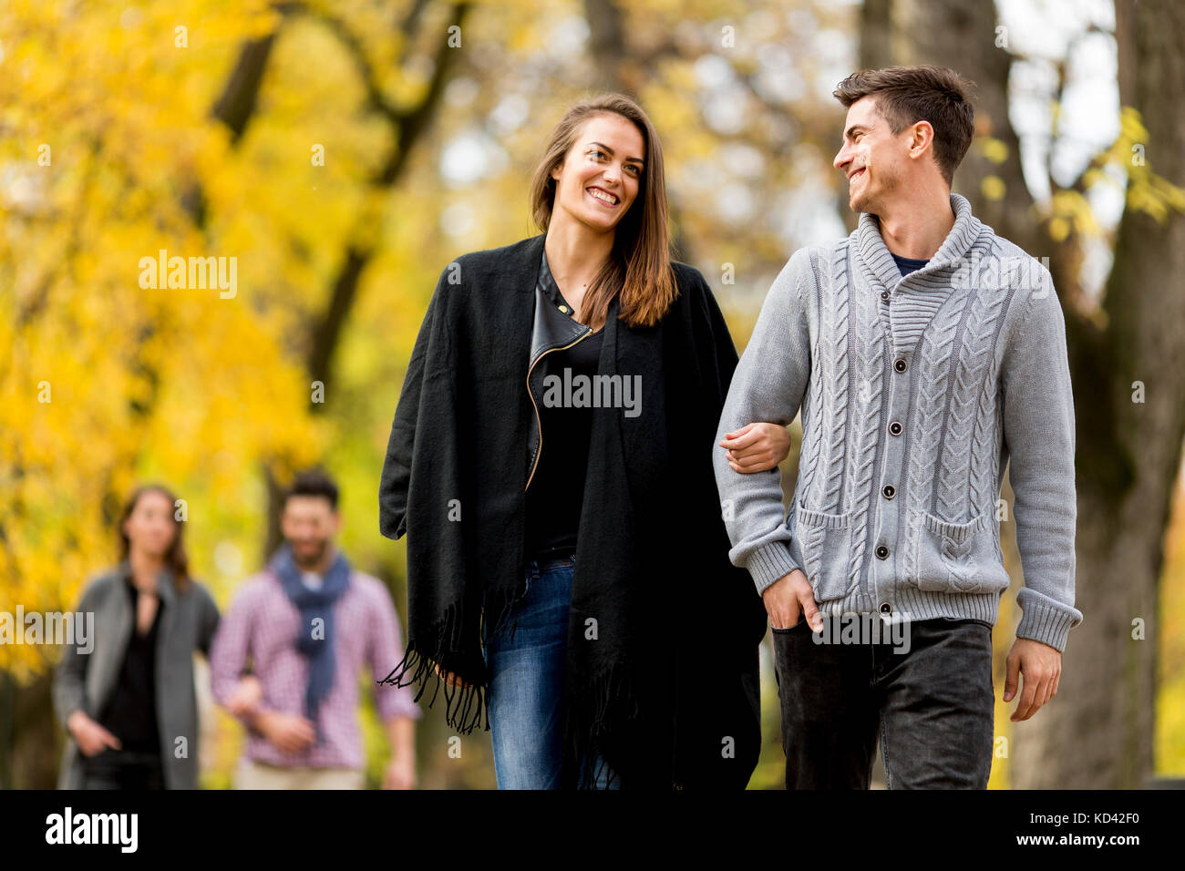 Young couple in love walking together in the park Stock Photo - Alamy