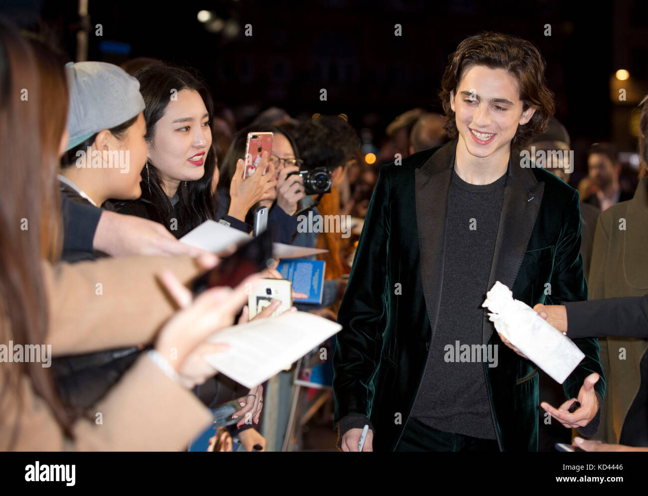 Timothee Chalamet with fans as he attends the premiere of Call Me By My ...