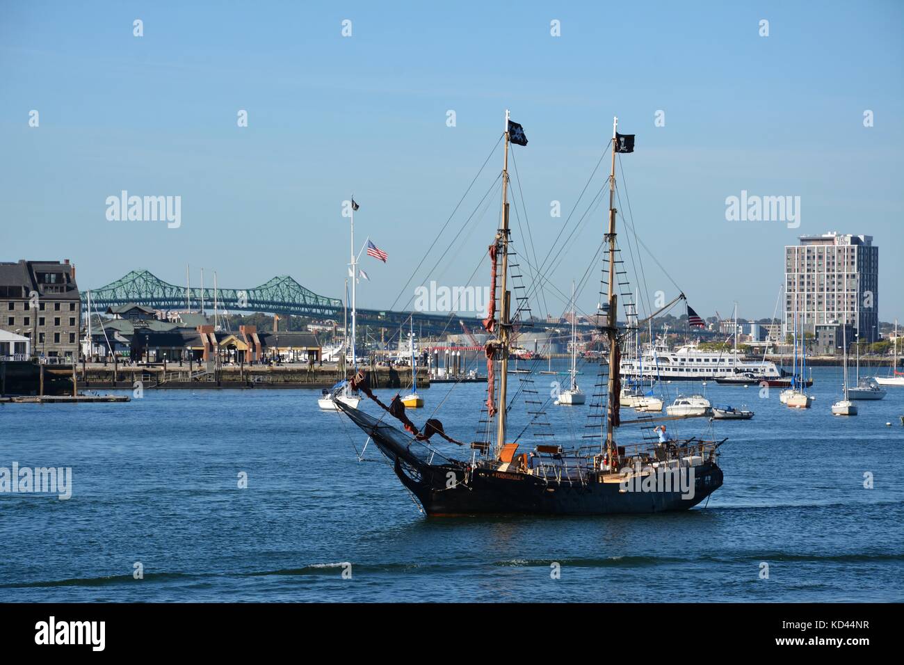 A tall ship in Boston Harbor near the Seaport/Downtown Boston Stock ...