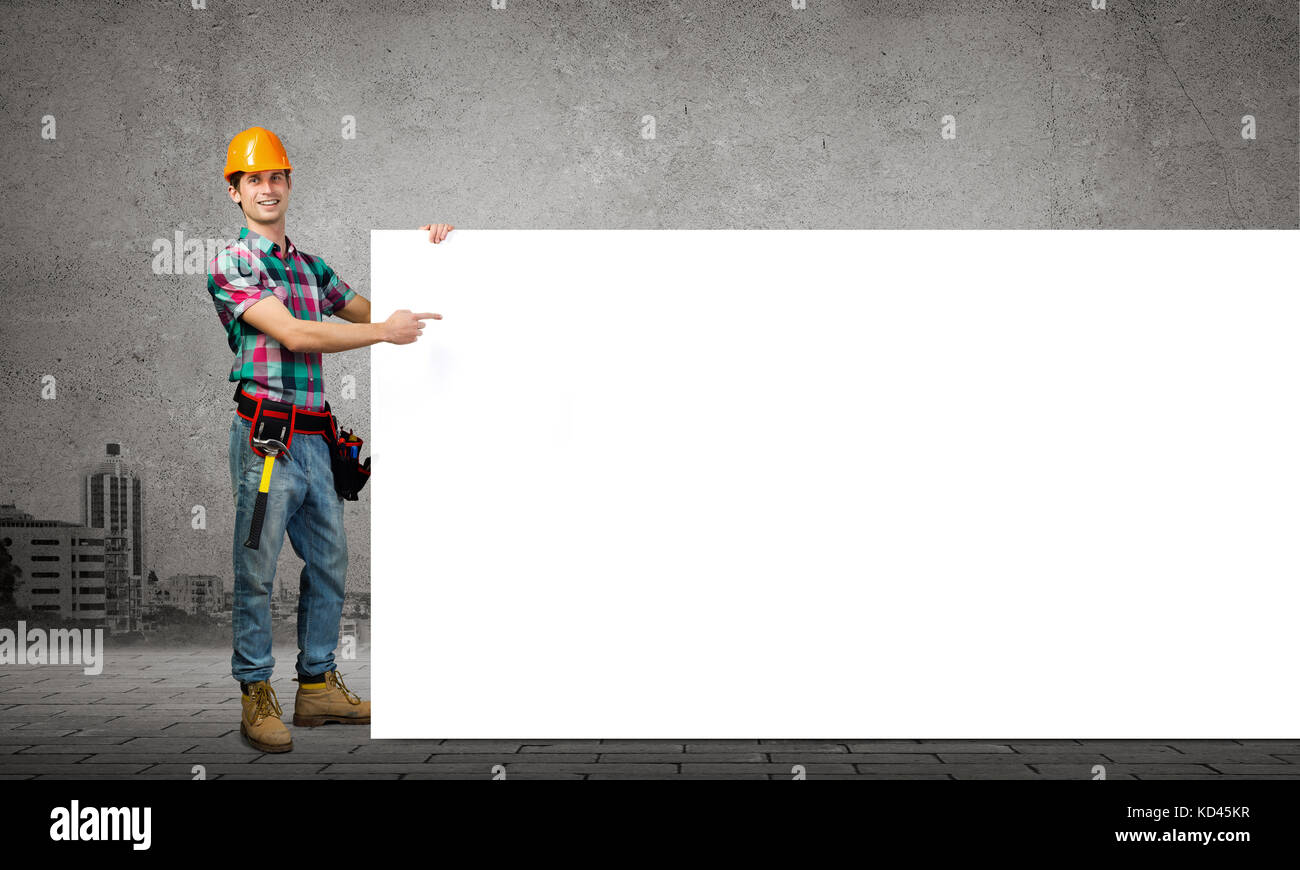 Repairman demonstrating banner Stock Photo - Alamy