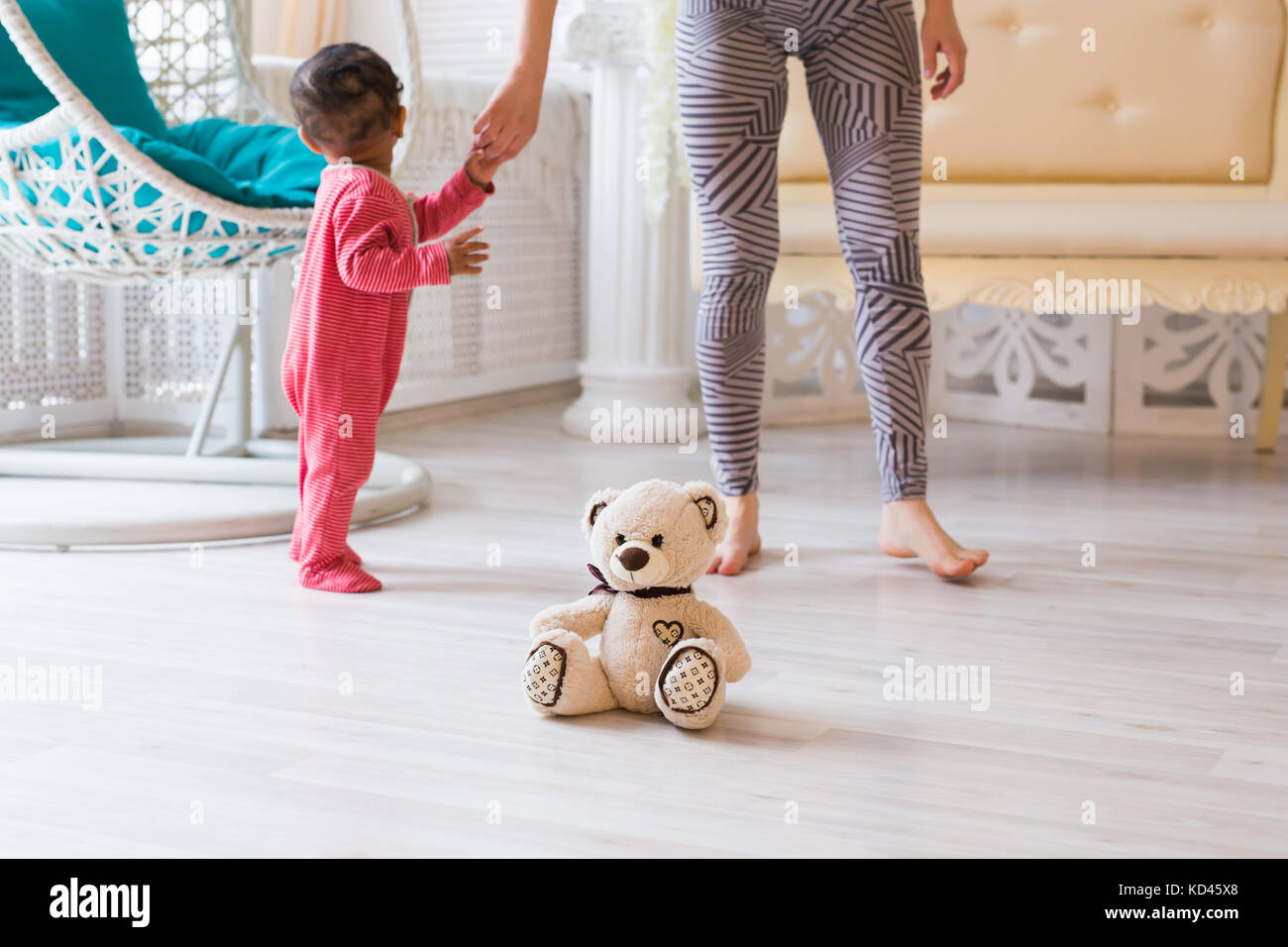 Happy baby boy playing with his teddy bear Stock Photo - Alamy