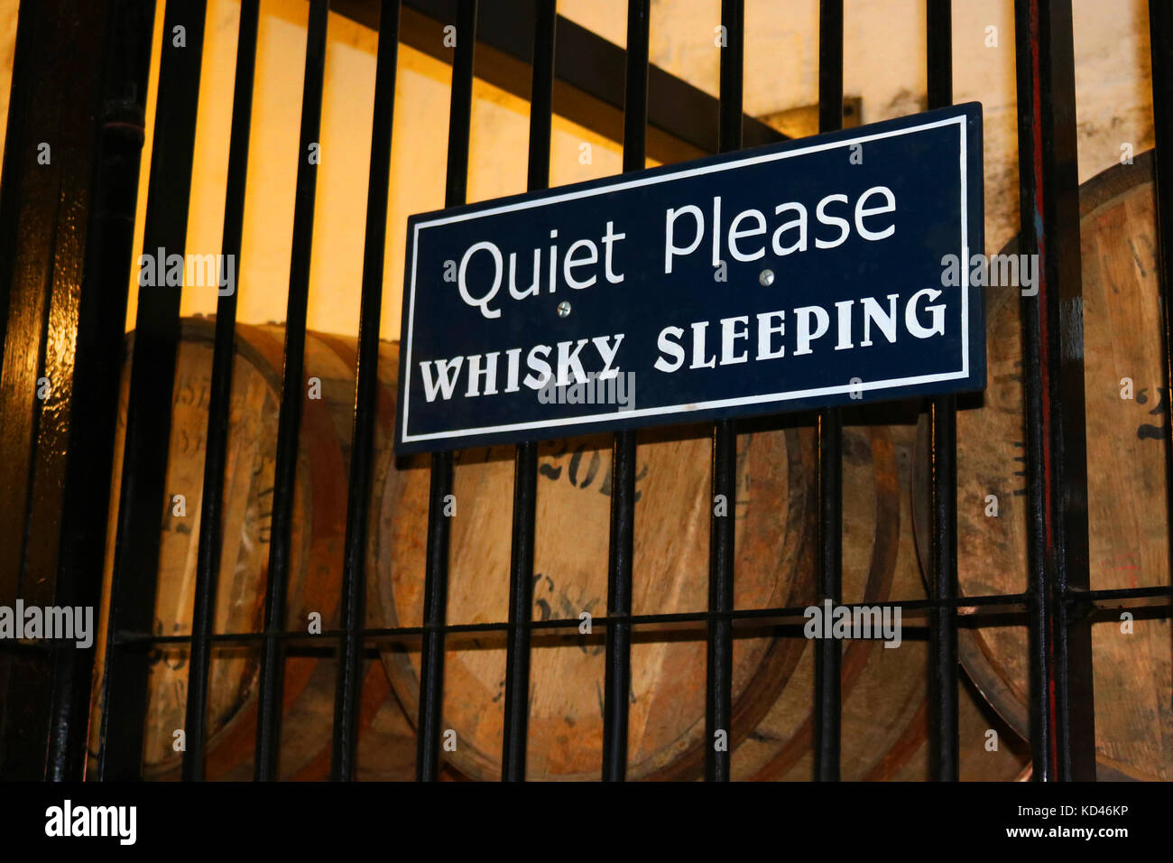 Wooden Barrels at Rest behind Iron Bars with Sign Quiet Please Whisky ...