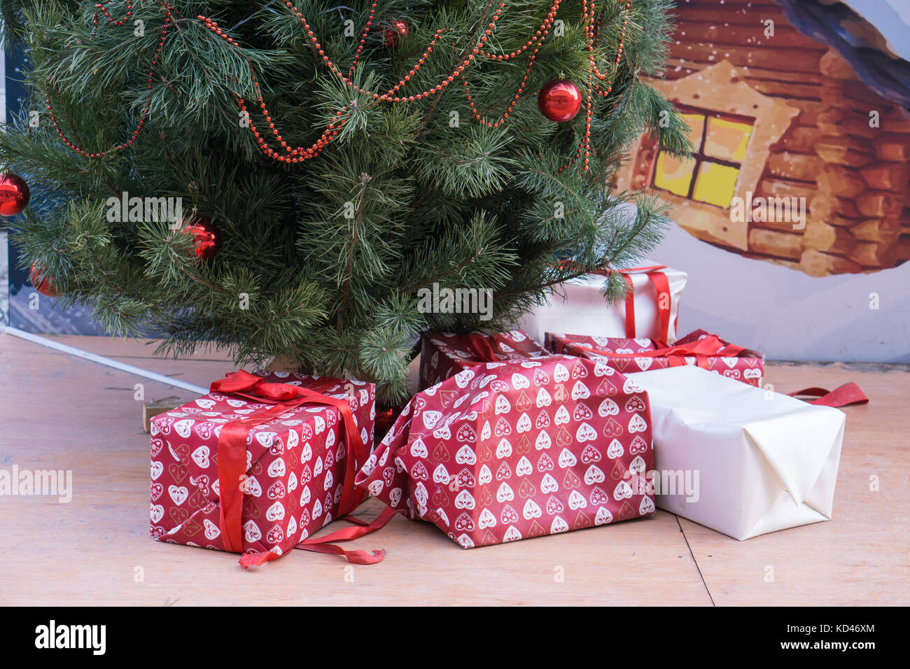 many different gift box presents under new year tree some of them ...