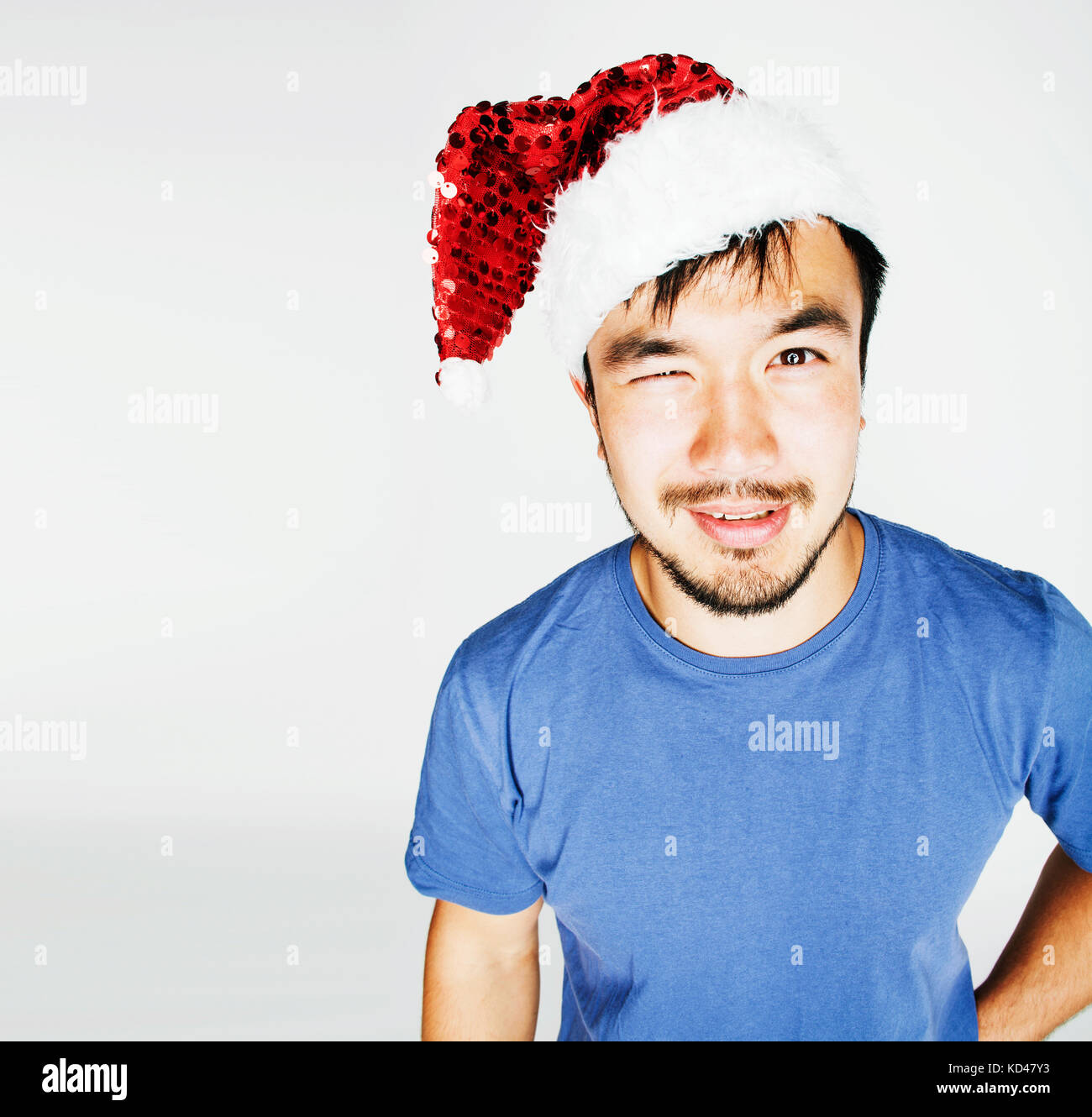 funy exotical asian Santa claus in new years red hat smiling Stock ...