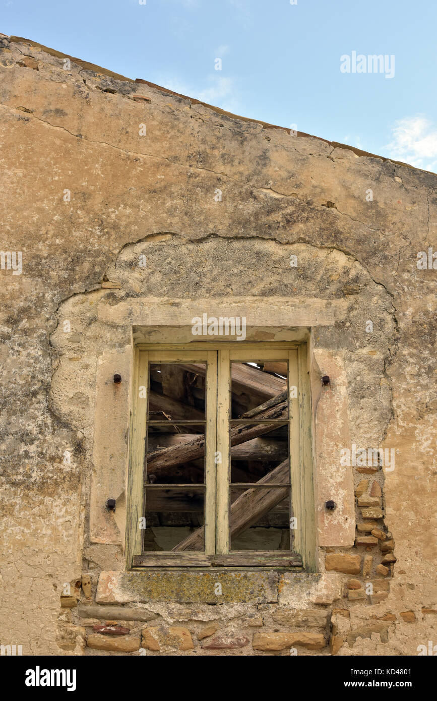 An old window frame in a derelict building in greece on the island of ...