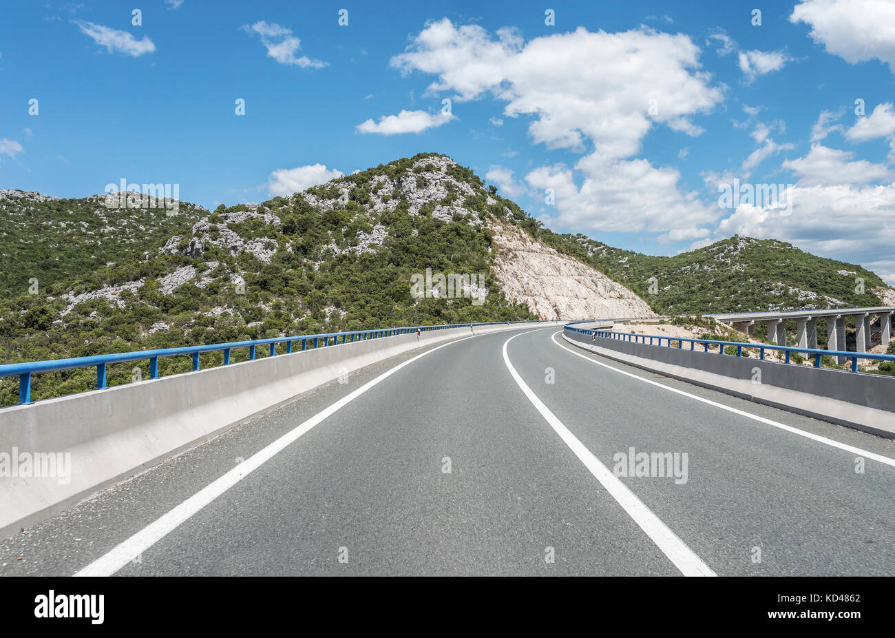 High-speed country road among the mountains Stock Photo - Alamy