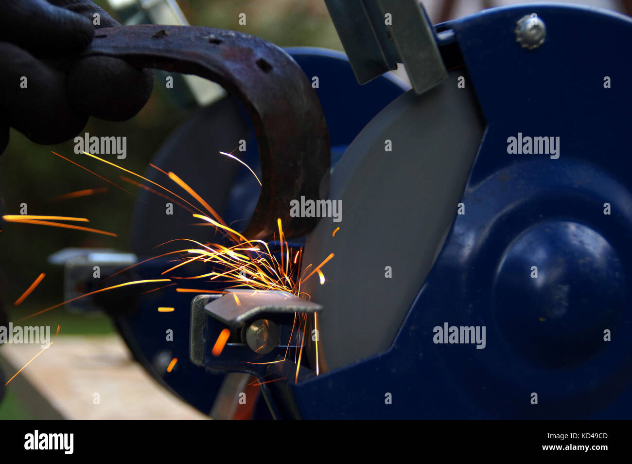 Electric wheel grinding with light sparks and gleam. Industry theme ...