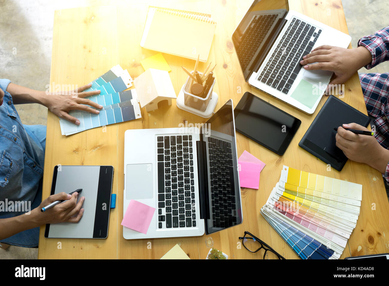 Team work for graphic design working on wood table with computer tablet ...