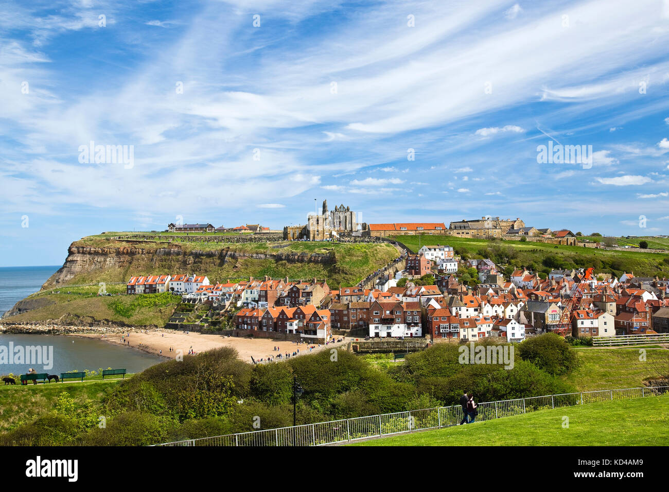 View of Church and Abbey ruins on top of cliffs above Whitby Town Stock ...