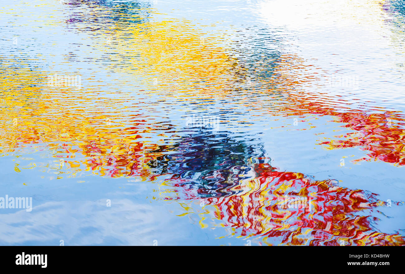 Rippled water surface texture. Bright colorful reflections, abstract ...