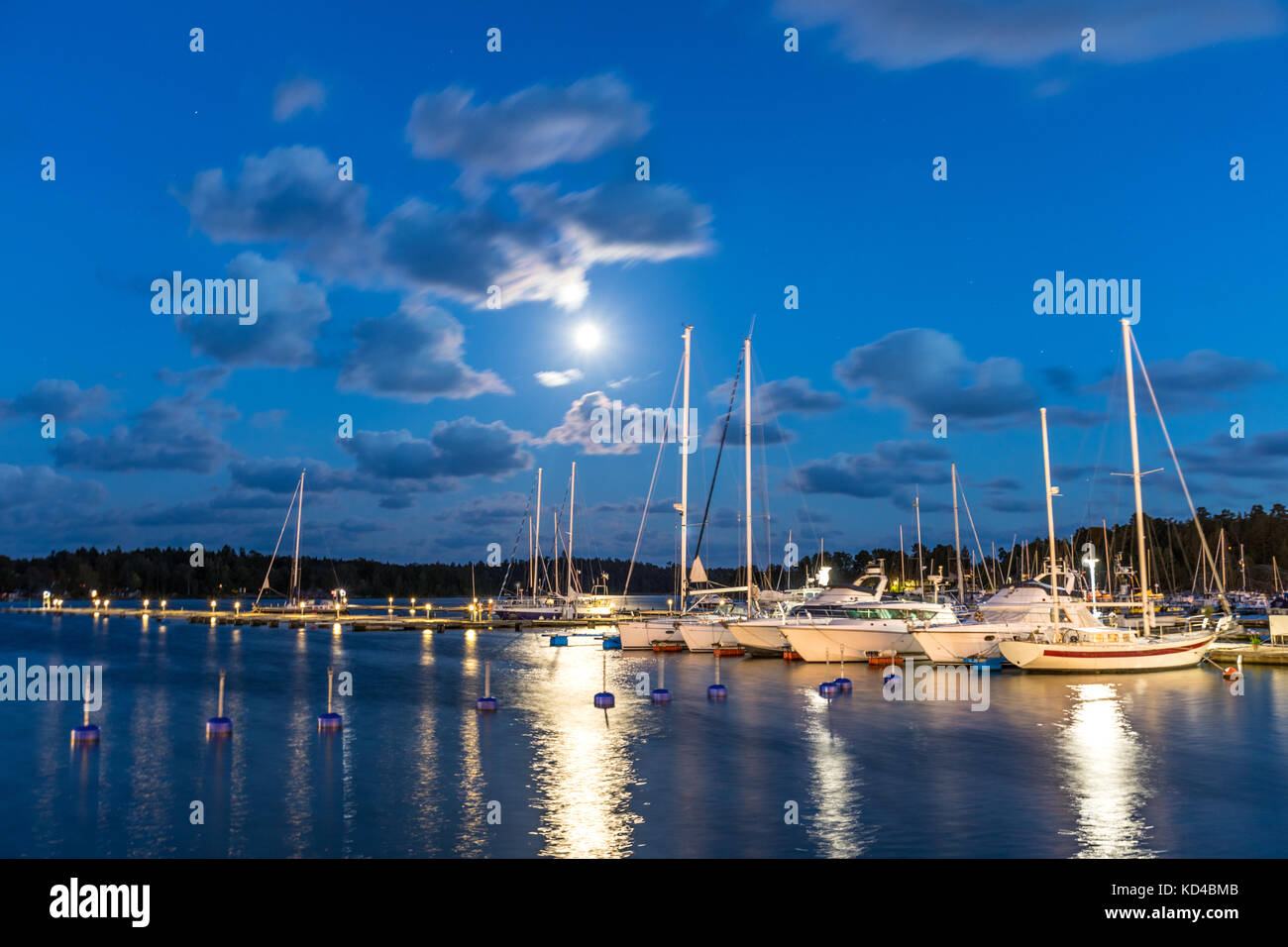 Sailing boats and yachts in marina at night with cloudy sky. Nynashamn ...