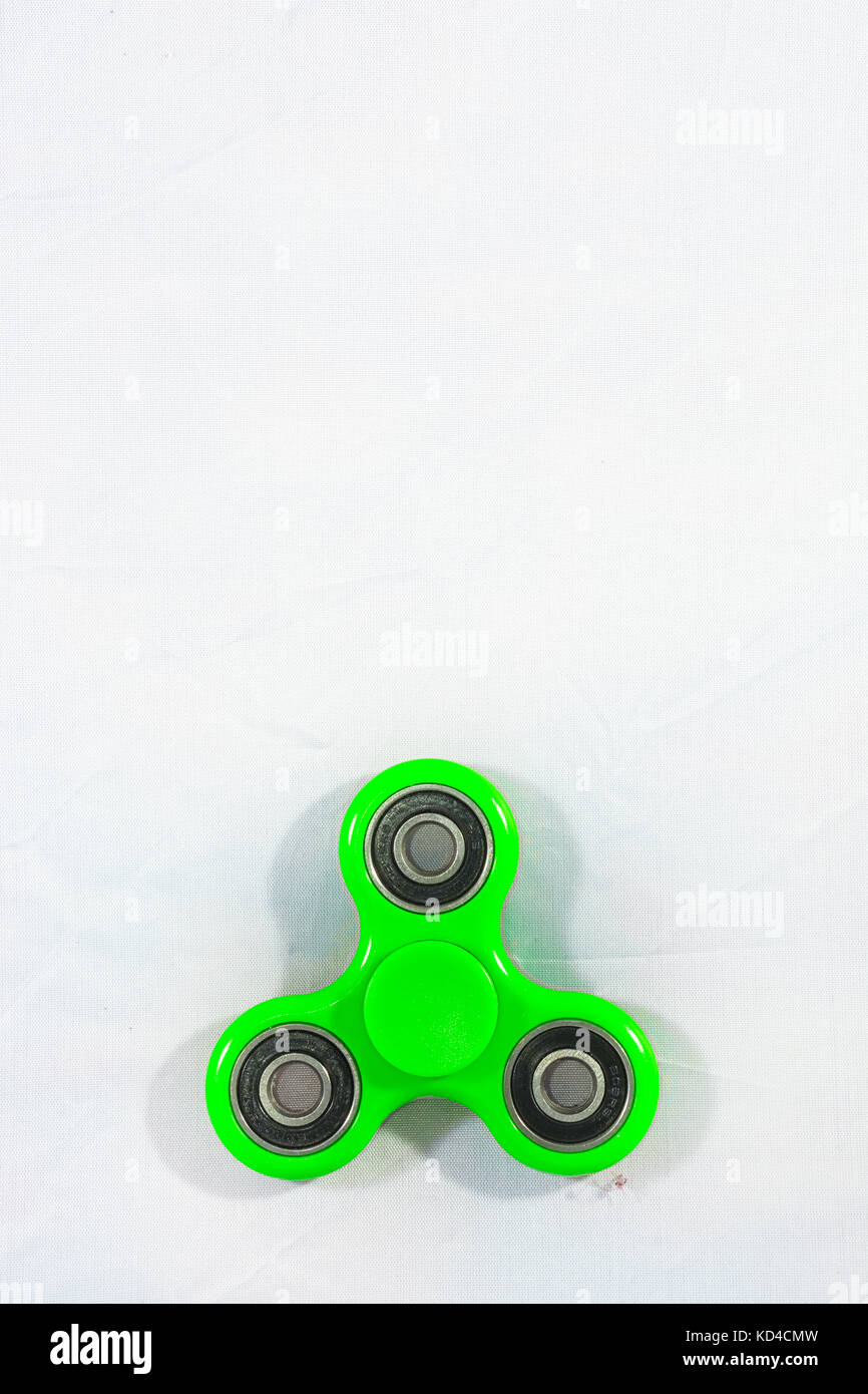 Fidget Spinner in white isolated background. The fidget spinner is a ...