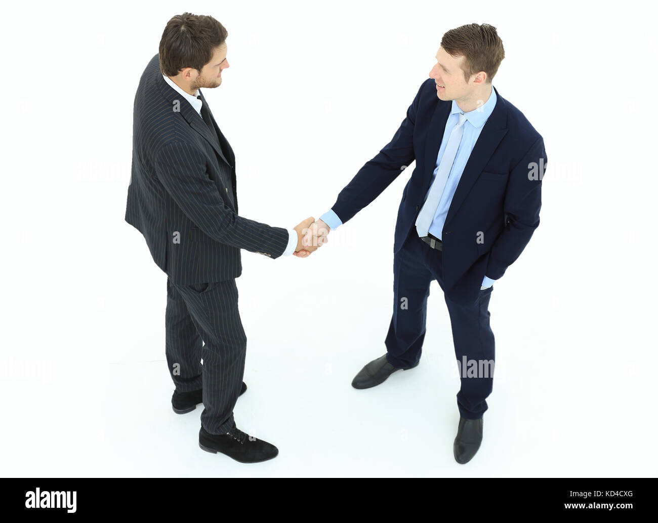 in full growth.handshake, business partners ,isolated on white ...