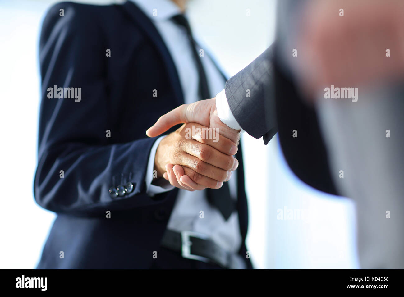Business men giving a handshake. Business concept Stock Photo - Alamy