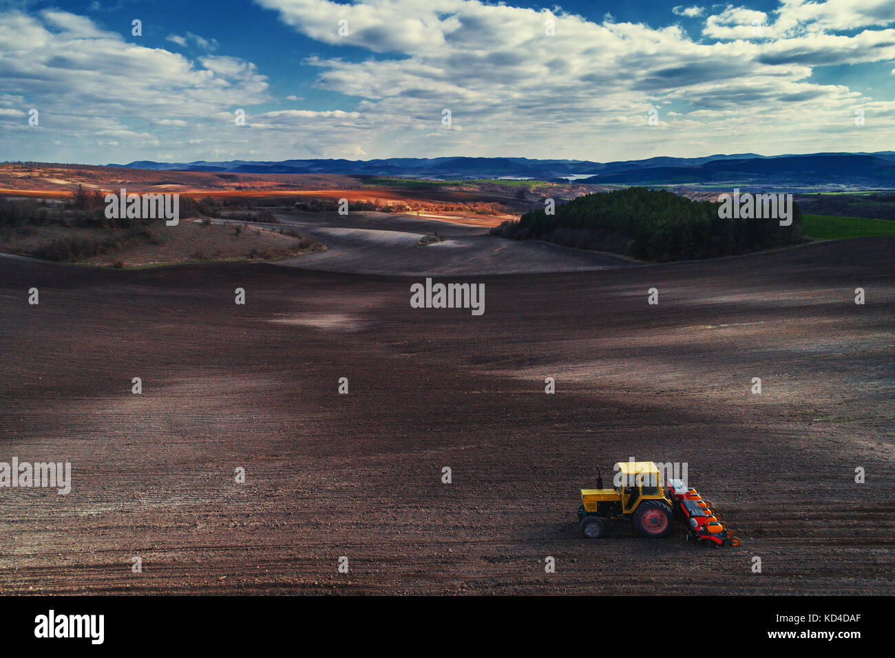 Aerial view of tractor working on the harvest field Stock Photo - Alamy