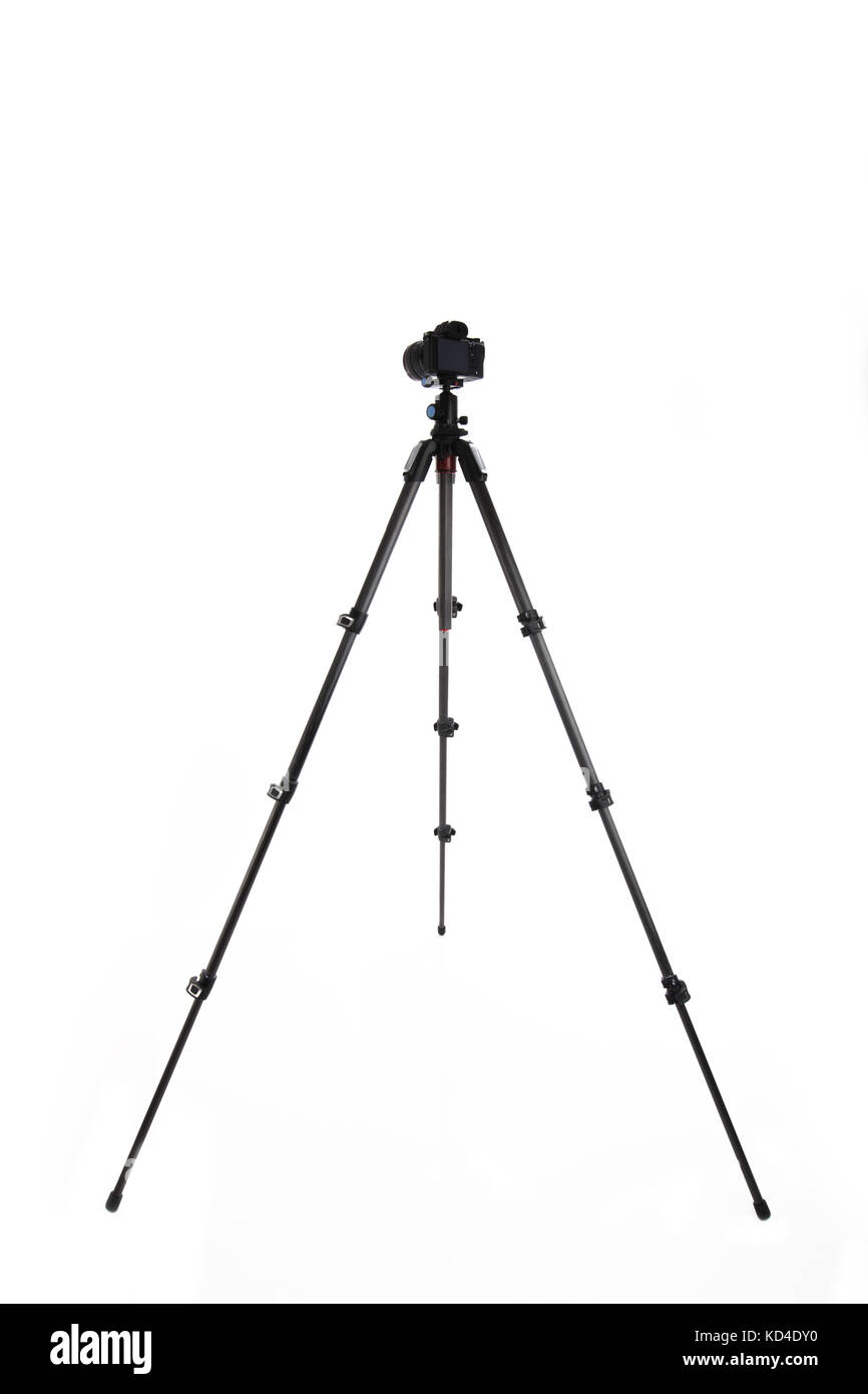 Photo camera on tripod isolated over white background Stock Photo - Alamy