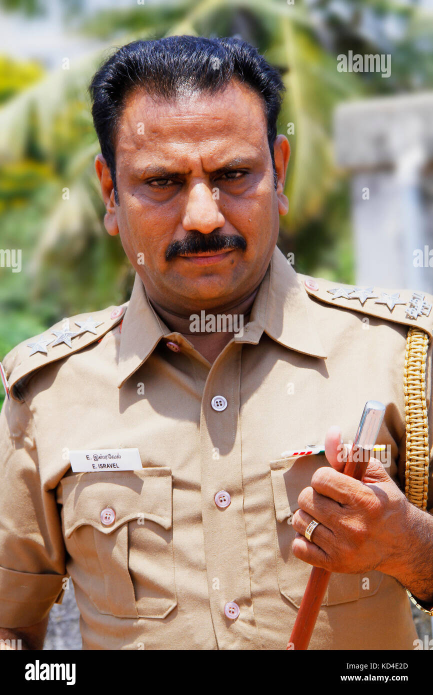 Indian police officer looking at outside Stock Photo - Alamy
