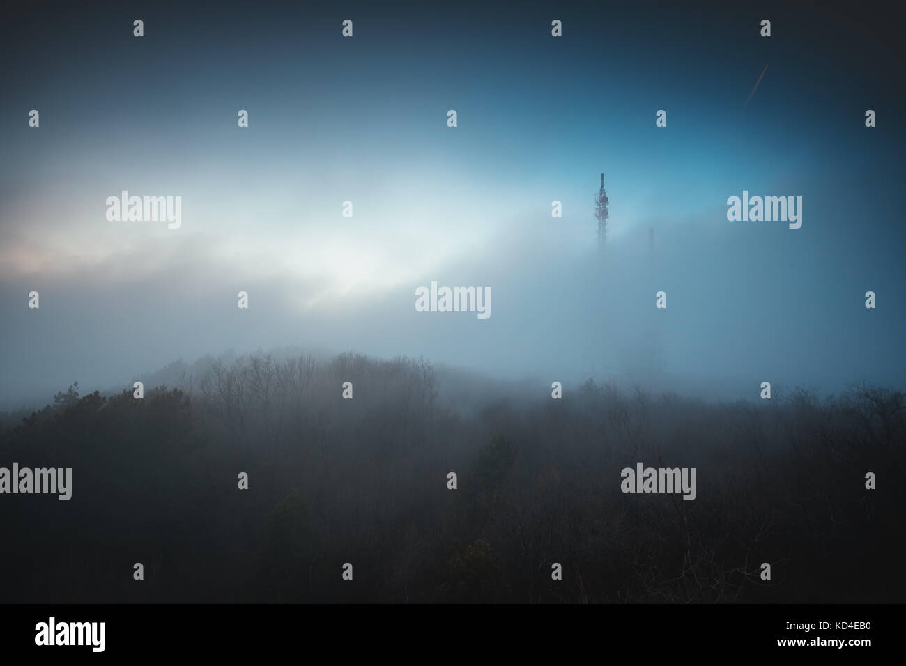 Misty fog over connection and radio tower in the mountain Stock Photo ...