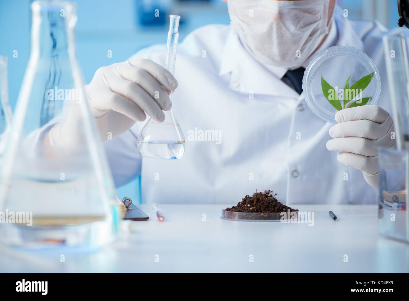 Male scientist researcher doing experiment in a laboratory Stock Photo ...