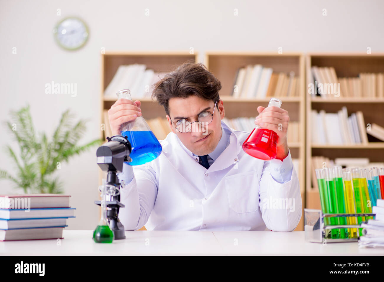 Mad crazy scientist doctor doing experiments in a laboratory Stock ...