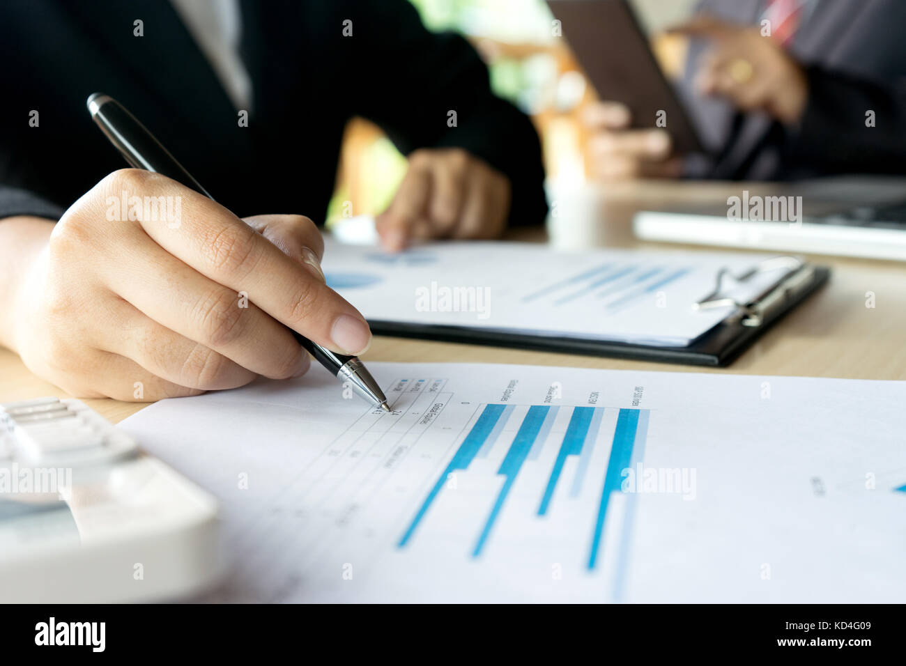 businessman working on paper to proof for maket plan Stock Photo - Alamy