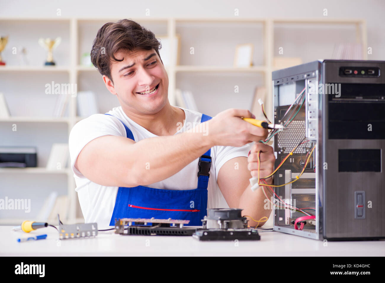 Computer repairman repairing desktop computer Stock Photo - Alamy