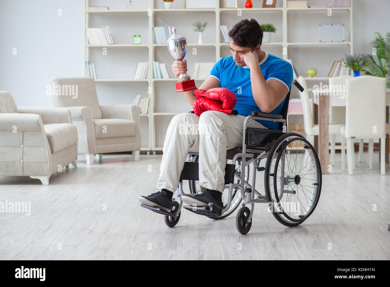 Disabled boxer at wheelchair recovering from injury Stock Photo - Alamy
