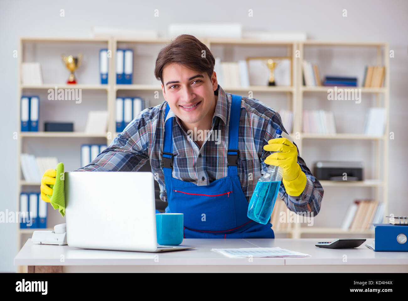 Male cleaner working in the office Stock Photo - Alamy