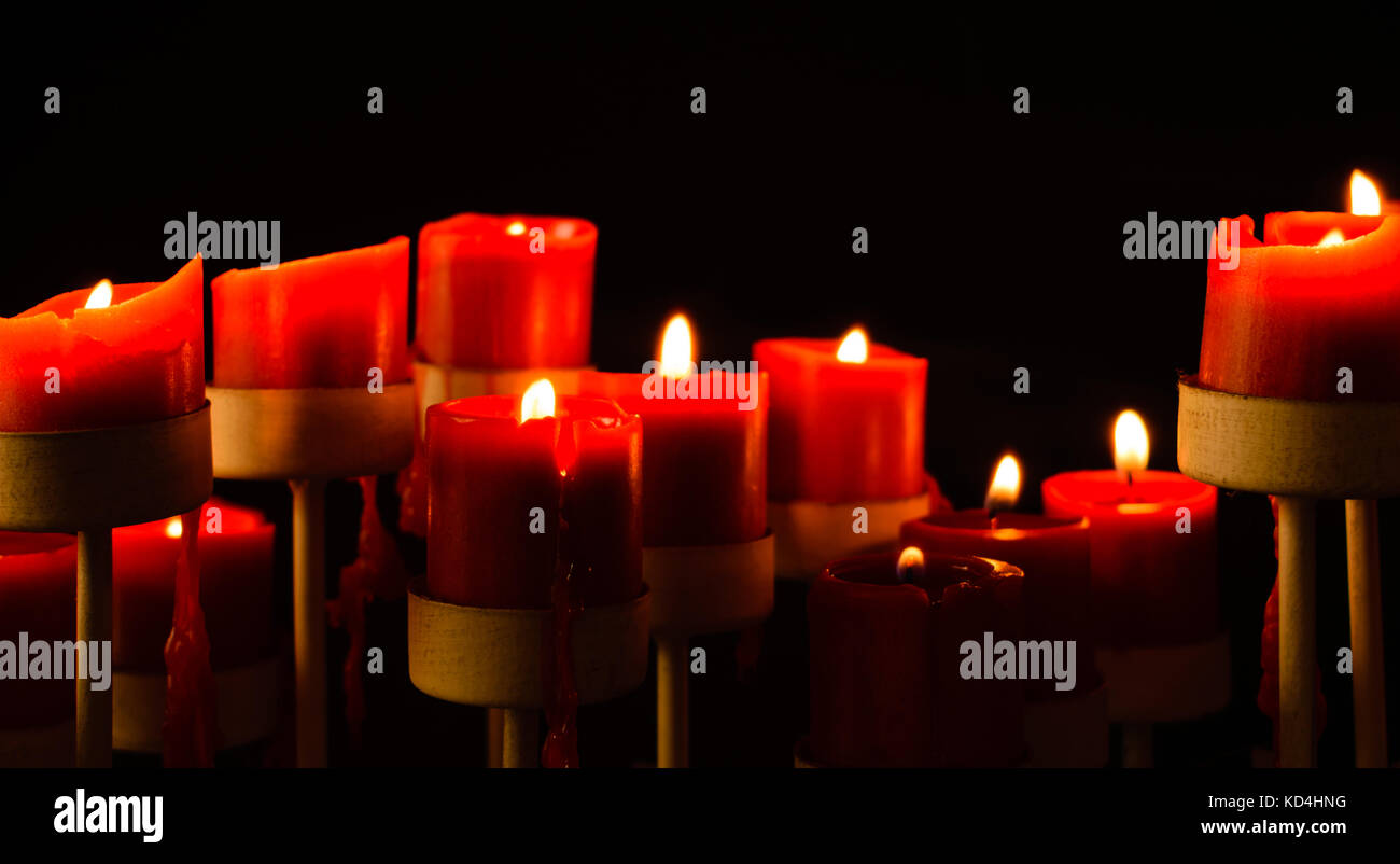 Red Candles on Dark Background Stock Photo - Alamy