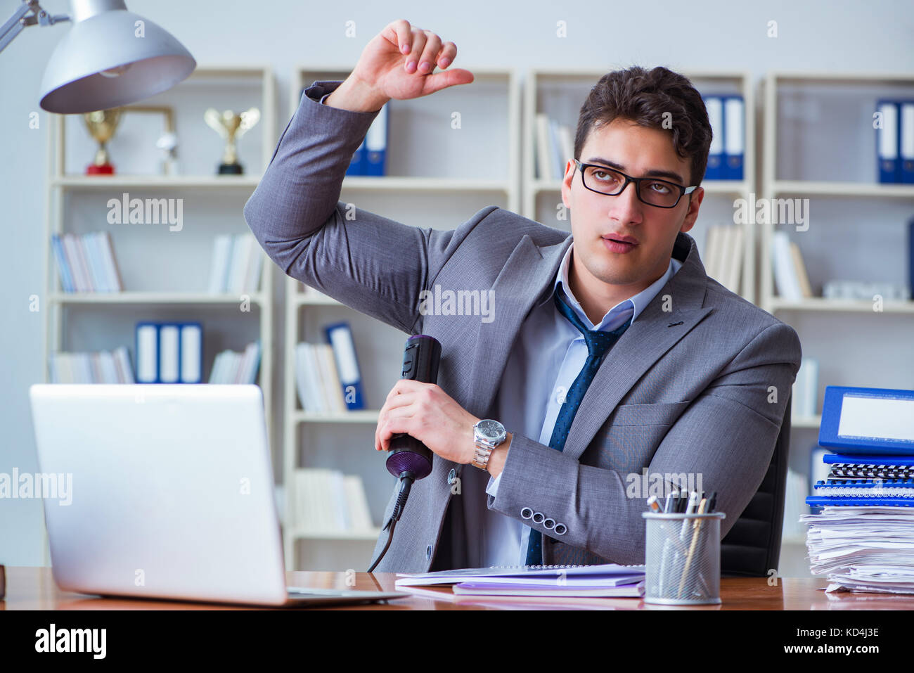 Businessman sweating excessively smelling bad in office at workplace ...